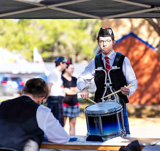 Young pipers concentrate intensely on their instruments, faces showing the kind of focus usually reserved for brain surgery or trying to assemble IKEA furniture without the instructions.