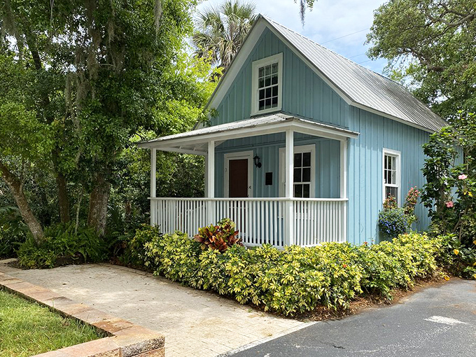 The charming blue Emmons Cottage stands as a nostalgic nod to old Florida, when life moved at the pace of a gentle breeze.