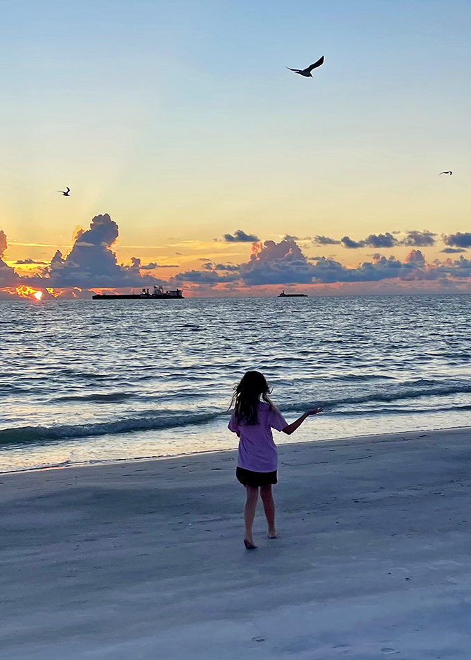 That magical moment when day surrenders to night, painting the horizon in fiery hues that make everyone pause mid-conversation.