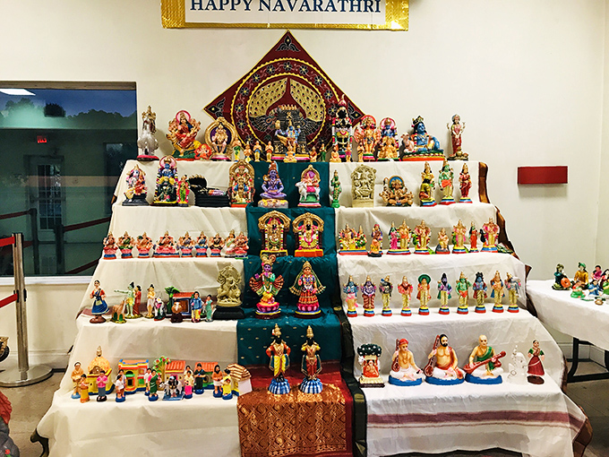 During Navaratri, this colorful Golu display of dolls and figurines transforms the temple into a miniature world of divine storytelling.