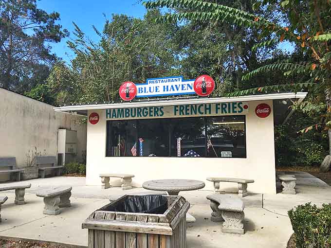 Imagine grabbing a classic burger and fries at this cheerful retro stand, a true slice of mid-century Americana.