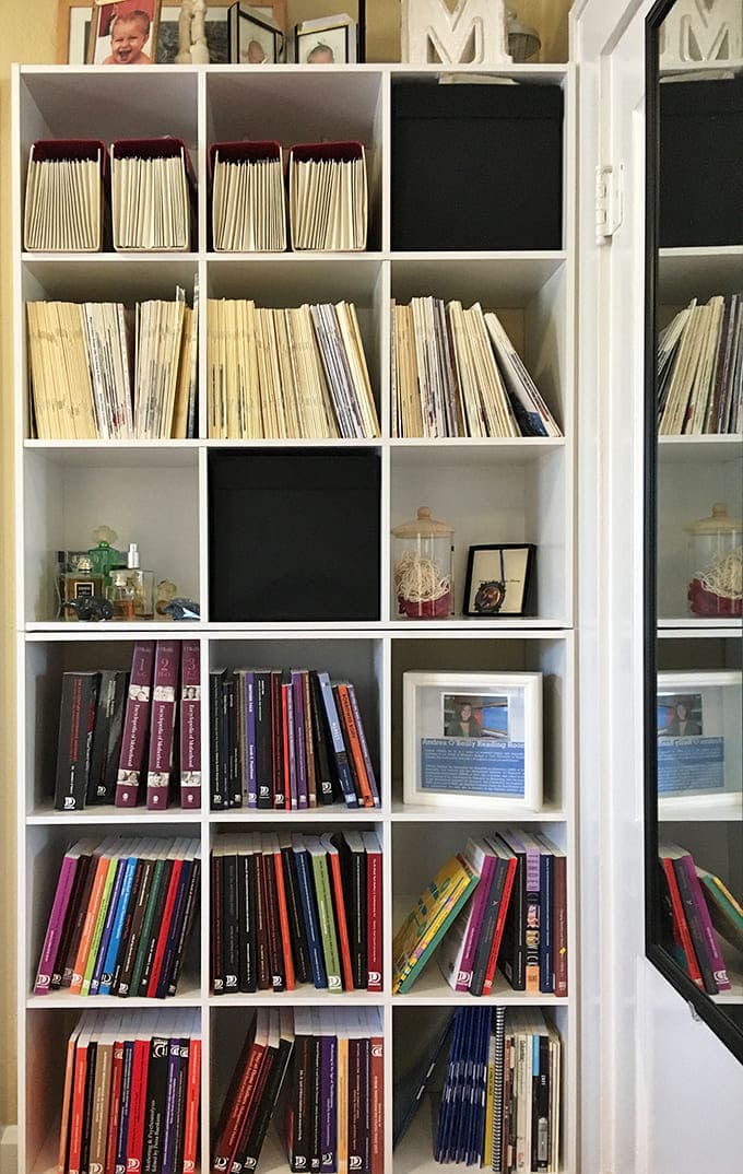 Shelves overflow with collected stories, each journal holding someone's truth about raising tiny humans.