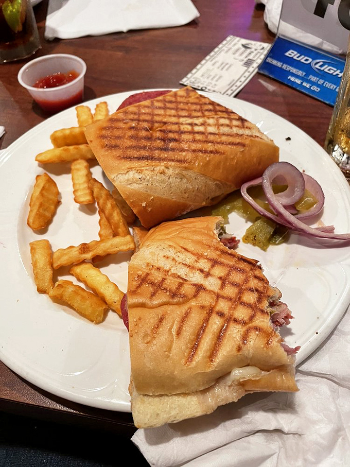 The panini arrives perfectly pressed, with crispy edges giving way to melty cheese and savory meats &ndash; a sandwich worth protecting.