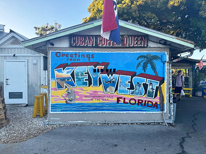 That vintage postcard mural is Key West's way of saying "Greetings" with the kind of style that modern Instagram filters can only dream about.