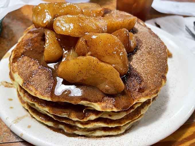 Pancakes stacked high and topped with cinnamon apples, because sometimes breakfast needs to feel like a warm hug from your favorite aunt.