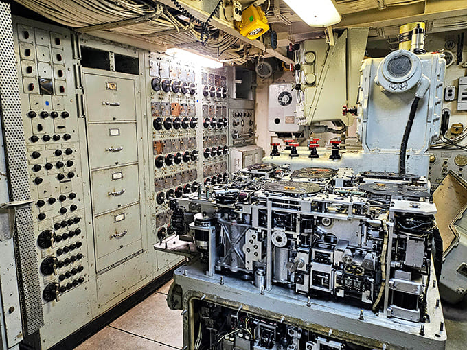 The plotting room displays navigation tools and charts, where officers tracked positions and planned tactical maneuvers during missions.