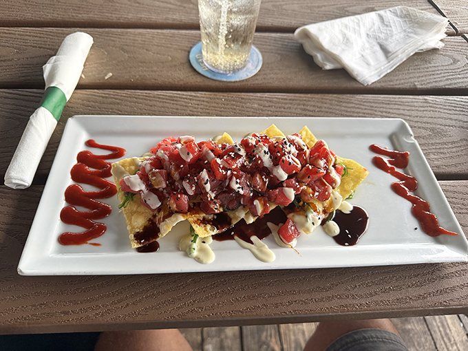 Tuna nachos that could start a religion &ndash; fresh ahi on crispy wontons with avocado and wasabi cream that'll make you guard your plate from friends.
