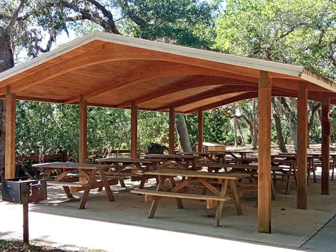 This rustic pavilion invites visitors to linger longer, because sandwiches always taste better with a side of scenic beauty.