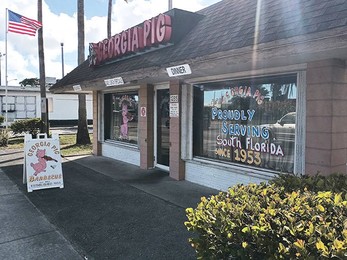 Georgia Pig's vintage storefront proudly announces it's been "SERVING SOUTH FLORIDA SINCE 1953" with its iconic pink pig mascot.