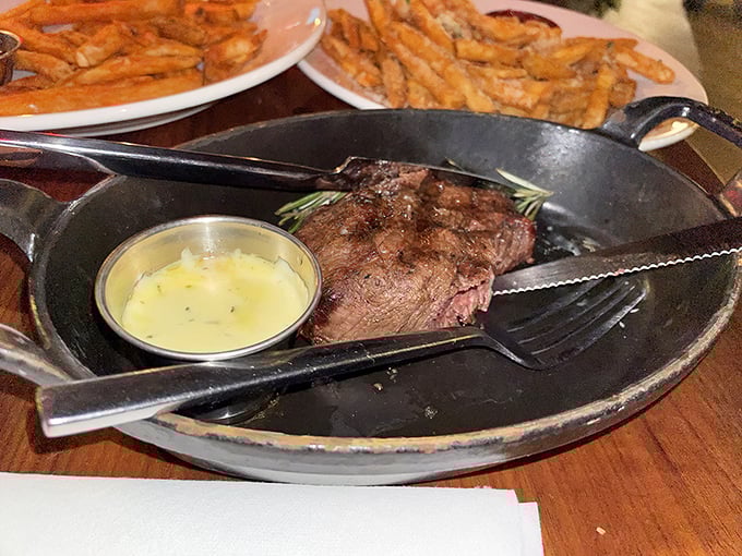 Perfectly seared steak served with golden fries makes for a satisfying meal at The Wreck Bar, where dining is elevated beyond the ordinary.