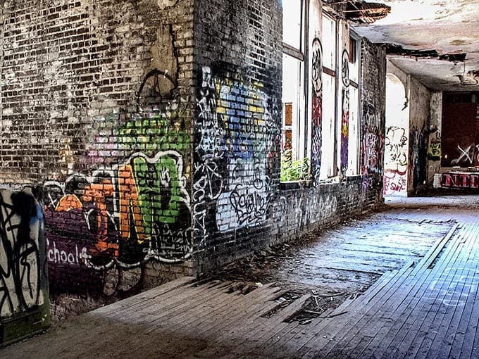 Every surface tells multiple stories, layers of graffiti creating an unintentional timeline of artists who found inspiration in these crumbling walls.