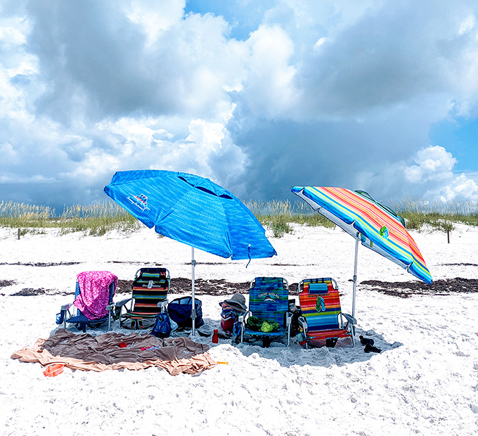 Beach chair philosophy: Life's problems seem smaller when viewed between your toes from beneath a colorful umbrella.