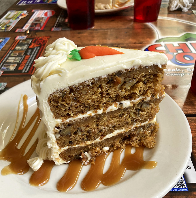 Three layers of moist, spiced perfection crowned with cream cheese frosting&mdash;worth every belt-loosening bite.