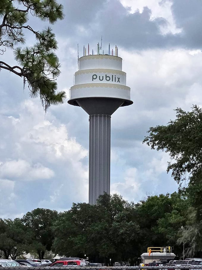 Majestic against cloudy Florida skies, the Publix cake tower rises above the parking lot like a dessert mirage that refuses to disappear after lunch.