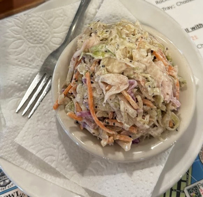 House-made coleslaw that refuses to be a mere side dish, demanding attention with its perfect crunch and tang.