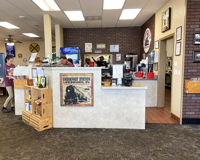 The counter area serves as command central, where breakfast magic happens and regulars exchange morning pleasantries over steaming coffee mugs.