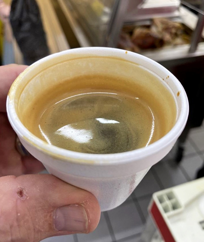 That tiny cup of Cuban coffee packs more punch than drinks three times its size – sweet, strong, and utterly essential.