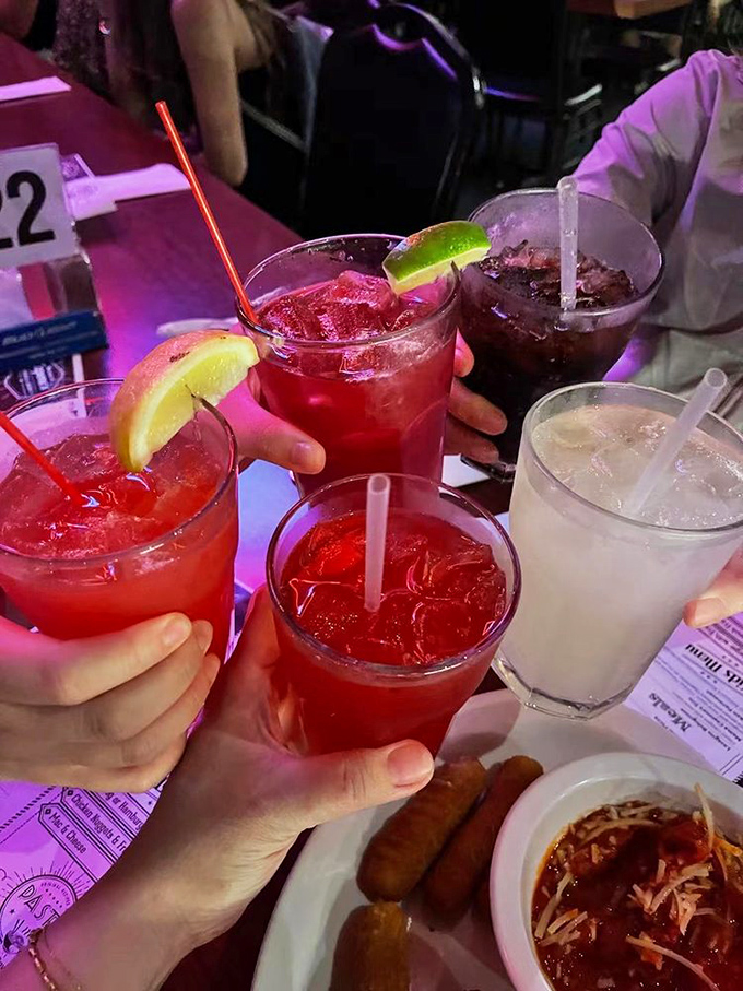 Colorful cocktails add to the speakeasy vibe, with each sip transporting you further into the Roaring Twenties experience.