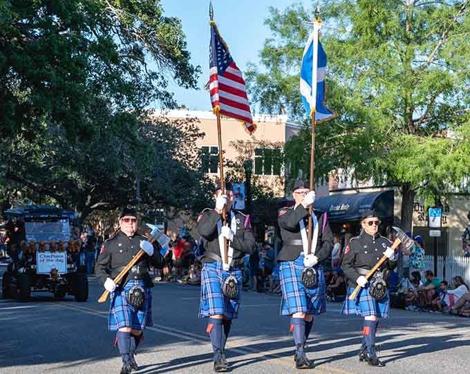 The parade transforms Dunedin's streets into a river of tartan and bagpipes, with American and Scottish flags flying side by side in perfect harmony.