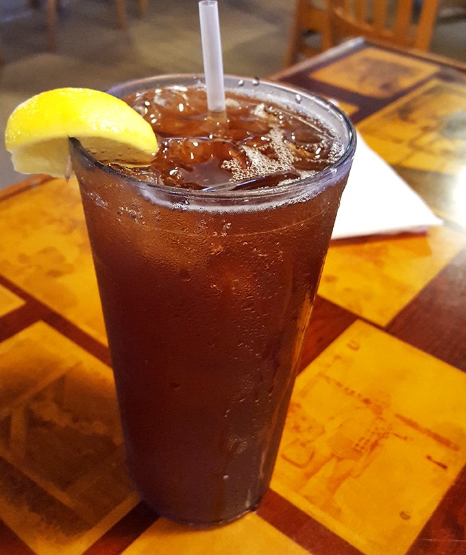 An iced tea so perfectly amber it could be mistaken for liquid topaz. The lemon slice isn't garnish&mdash;it's the exclamation point on a Florida afternoon.