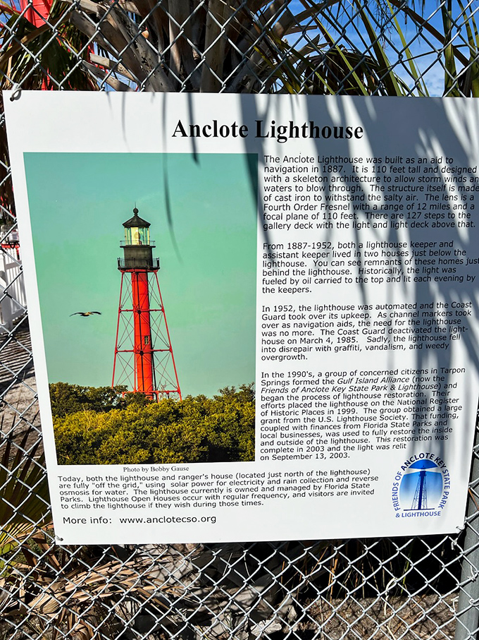 Informational Signage: Nature's classroom stands open-air, teaching visitors about the lighthouse's skeleton design that dances with hurricane winds.