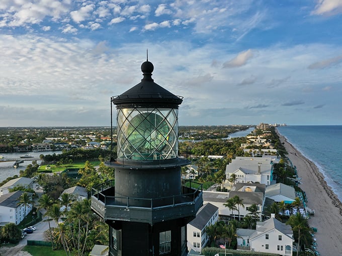 As day fades to dusk, the lighthouse begins its nightly performance, casting golden reflections across waters that have witnessed countless maritime stories.