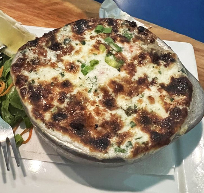 A bubbling dish of cheesy decadence that makes you wonder why more foods aren't improved with a blanket of melted goodness.