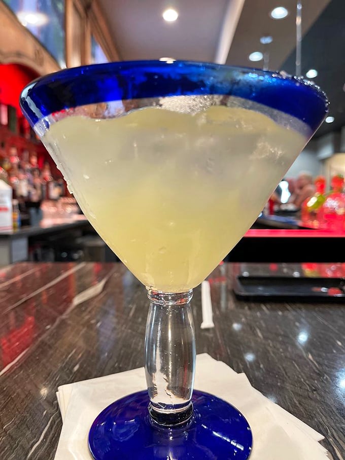 That blue-rimmed margarita glass isn't just pretty, it's your ticket to forgetting that tomorrow is Monday and you have responsibilities.