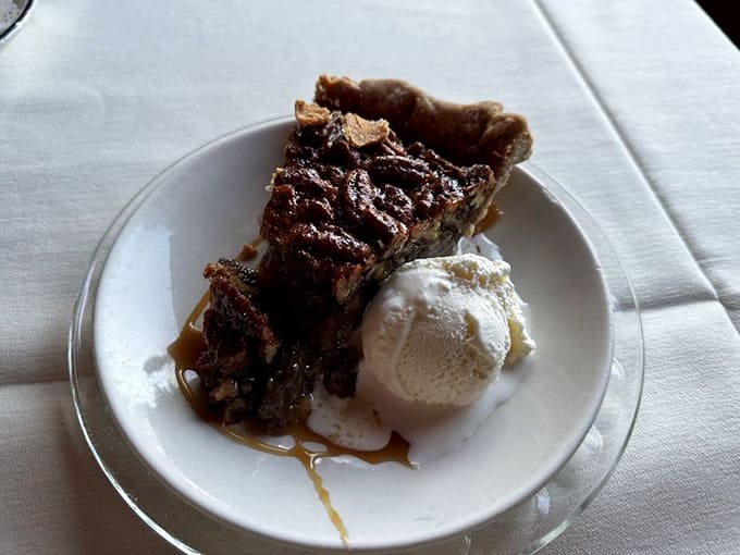 Pecan pie with ice cream: because every great meal deserves a sweet, nutty, slightly melty ending.