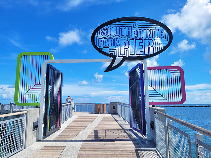 The South Pointe Park Pier welcomes you through its colorful gateway, promising ocean views that'll make your phone storage cry.