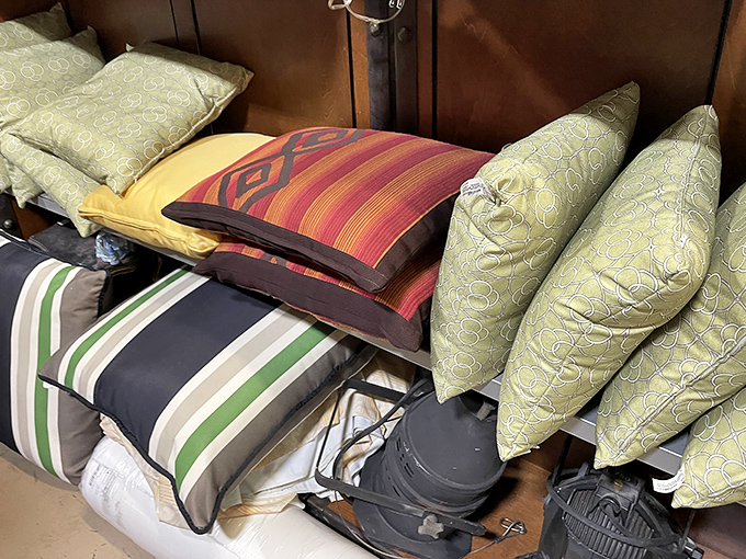 A mountain of pillows and textiles offers comfort with character &ndash; each one bringing decades of style that puts modern mass-produced cushions to shame.