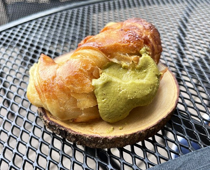 A pistachio croissant that makes butter and flour perform acrobatics worthy of an air show.