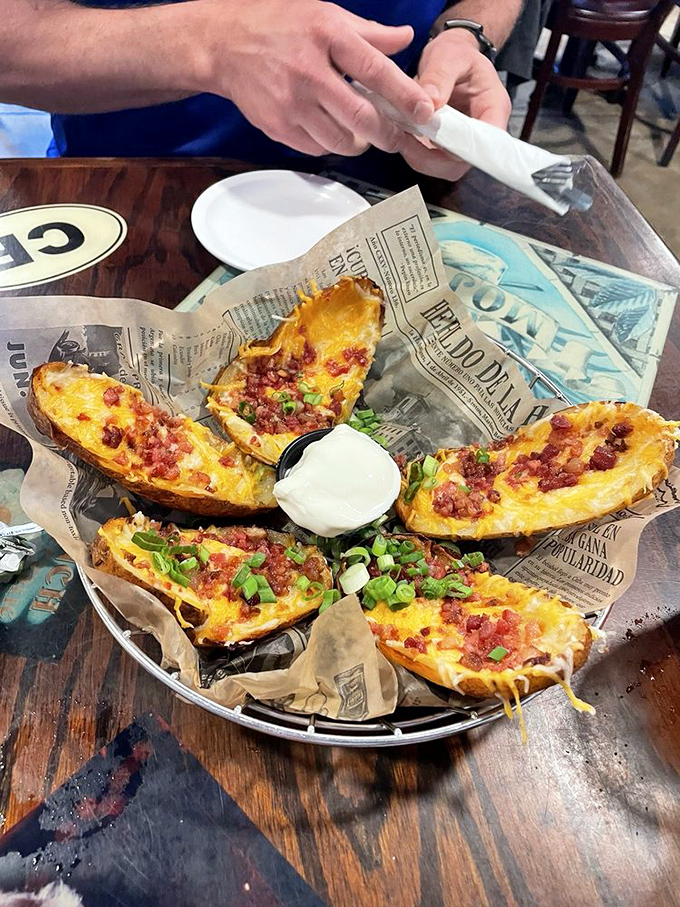 Loaded potato skins that could convert a carb-avoider. Cheese, bacon, and potato &ndash; the holy trinity of appetizer perfection.