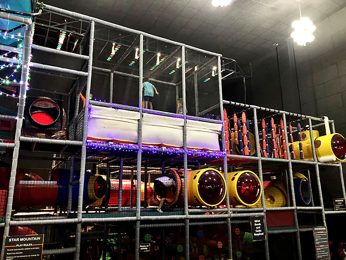 Star Mountain's climbing structure challenges young adventurers with colorful tubes and tunnels, a vertical playground reaching skyward.