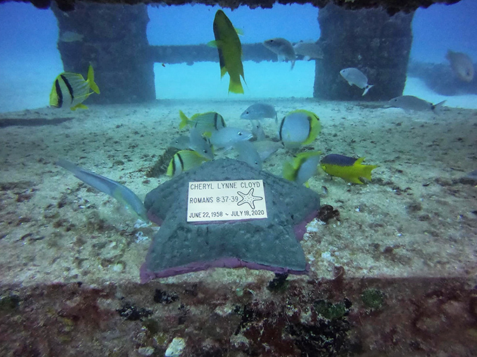 This star-shaped memorial creates a poignant moment underwater, where biblical verses and remembrances become part of the ocean's eternal rhythm.
