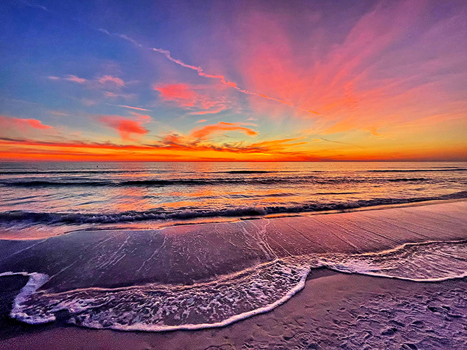 When the sky puts on its nightly watercolor show, turning the Gulf into a mirror of impossible colors.