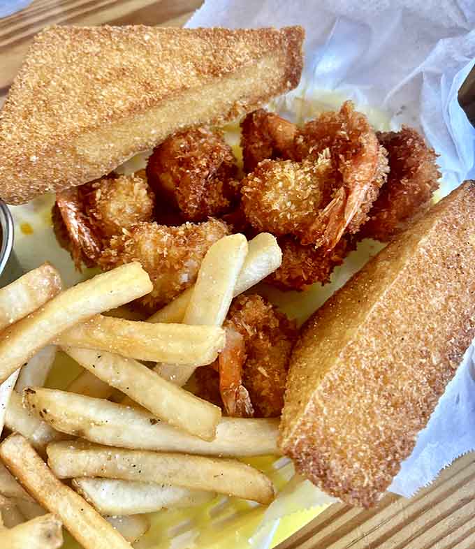 Fried shrimp proving that Florida's coastal influence reaches inland, bringing perfectly crispy seafood to breakfast and lunch menus alike.