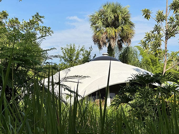 Summer brings lush greenery that frames the distinctive architecture, showing how the structures integrate beautifully with their natural surroundings.