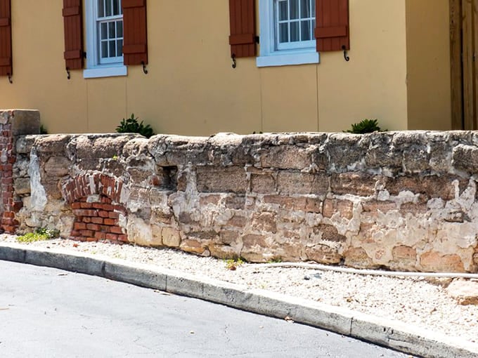 The southern wall shows its age proudly, with exposed brick and weathered stone that would make any Instagram filter jealous of its authentic vintage look.
