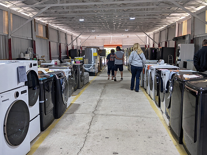 The appliance section stretches like a white goods runway, where washers and dryers stand at attention, waiting for budget-conscious shoppers seeking household necessities.