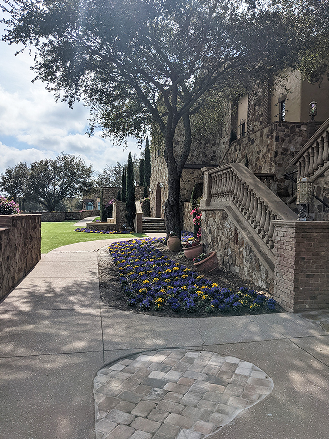 Vibrant flowers line pathways throughout the property, working overtime to maintain the Mediterranean illusion despite Florida's best humidity efforts.