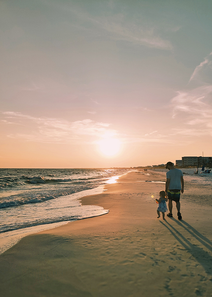 A tender moment between parent and child unfolds against nature's most spectacular backdrop.