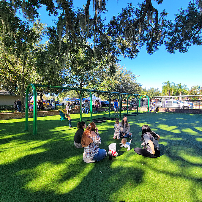 Friends gather on the soft grass, creating those spontaneous community connections that make public parks the true living rooms of our neighborhoods.
