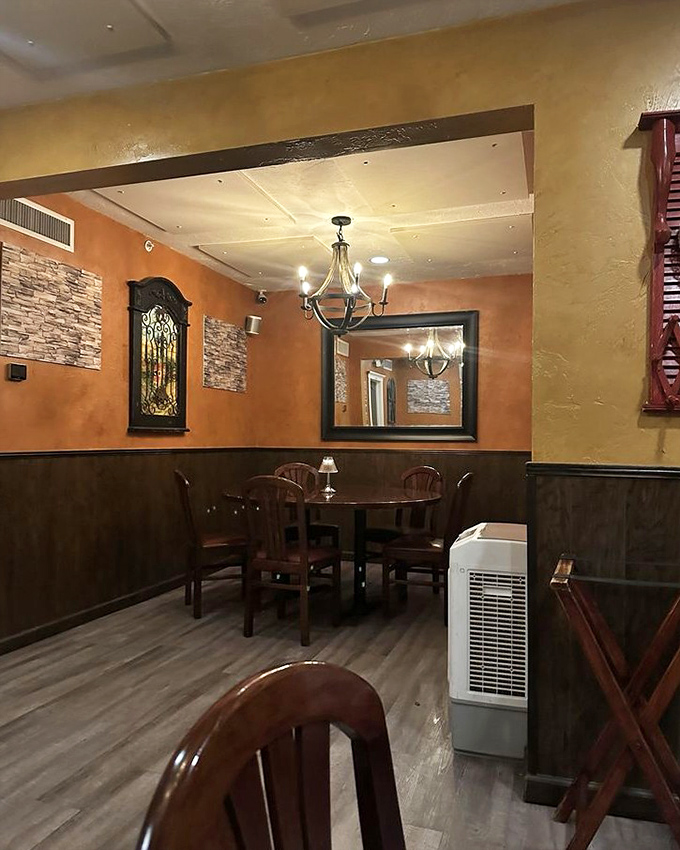 The wine room whispers promises of perfectly paired vintages, where every bottle has a story waiting to be uncorked.