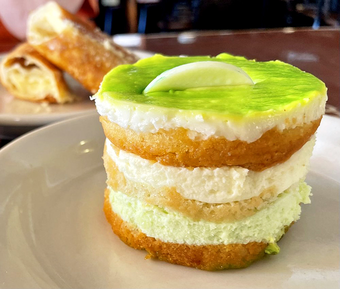 The layered lime cake isn't just dessert – it's a sweet-tart architectural marvel that makes you wonder why all desserts don't come in these perfect, photogenic stacks.