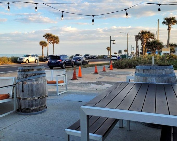 Ocean views and string lights create the perfect backdrop for wine-fueled conversations that inevitably turn philosophical as the sun sets.