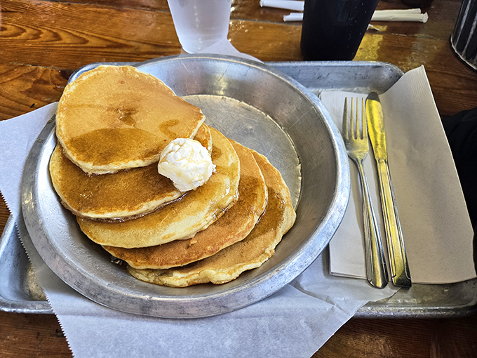 These aren't just pancakes&mdash;they're fluffy golden discs of joy, stacked high and crowned with a melting pat of butter.