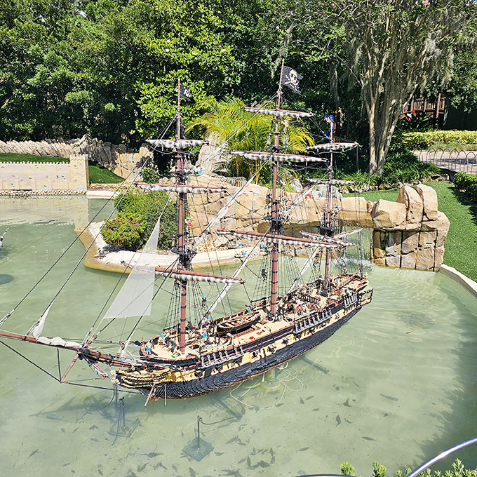 A pirate ship worthy of Captain Jack Sparrow sails through actual water, showcasing how LEGOLAND blends real elements with brick-built fantasy.