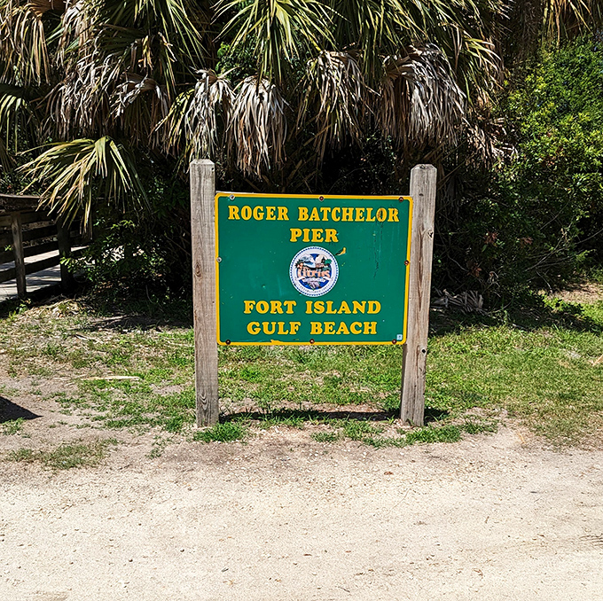 The Roger Batchelor Pier sign stands as a humble landmark&mdash;no neon, no flash, just straightforward directions to where the fish might be biting.