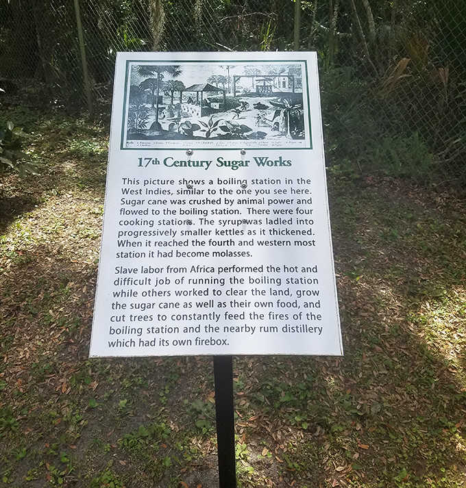 Educational signage reveals the labor-intensive process behind 17th-century sugar production &ndash; hot, difficult work that sweetened colonial coffers.